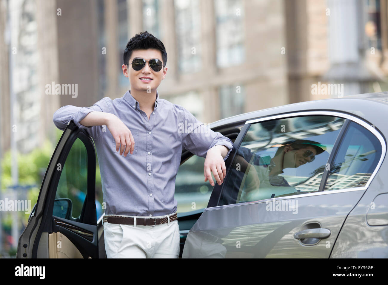Man standing next to door of car hi-res stock photography and images ...
