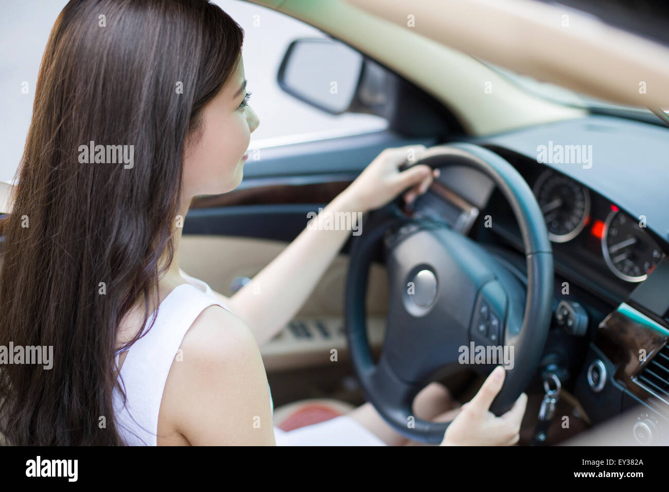 Indian young woman driving a car hi-res stock photography and images - Alamy