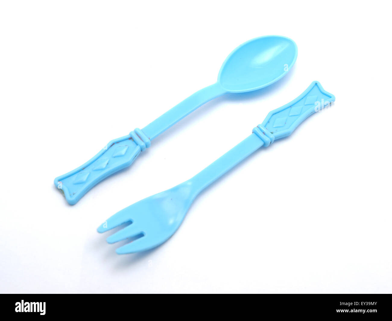 Plastic baby spoon on a white background Stock Photo - Alamy