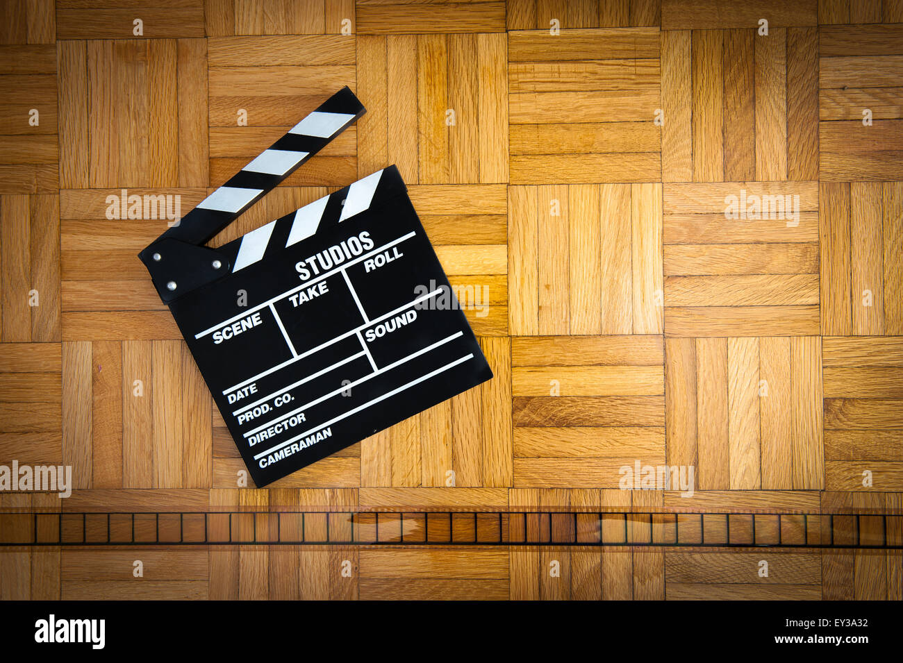 Cinema movie clapper board and 35 mm horizontal line filmstrip on ...