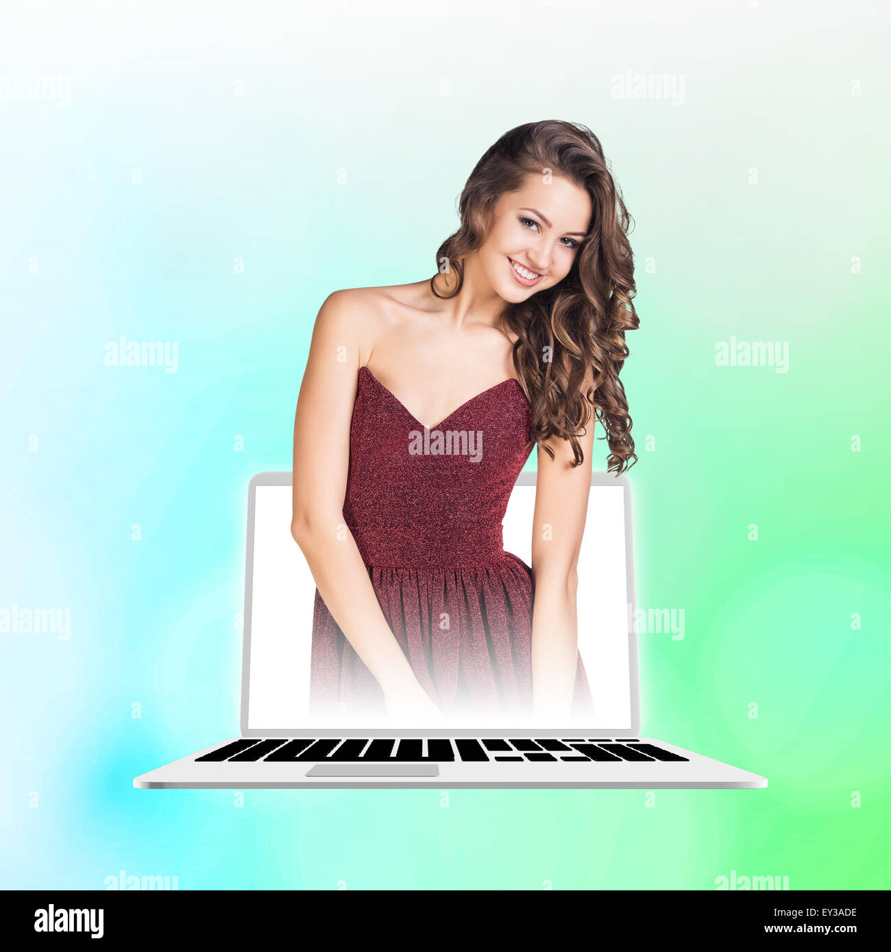 Pretty woman coming out of laptop computer Stock Photo - Alamy