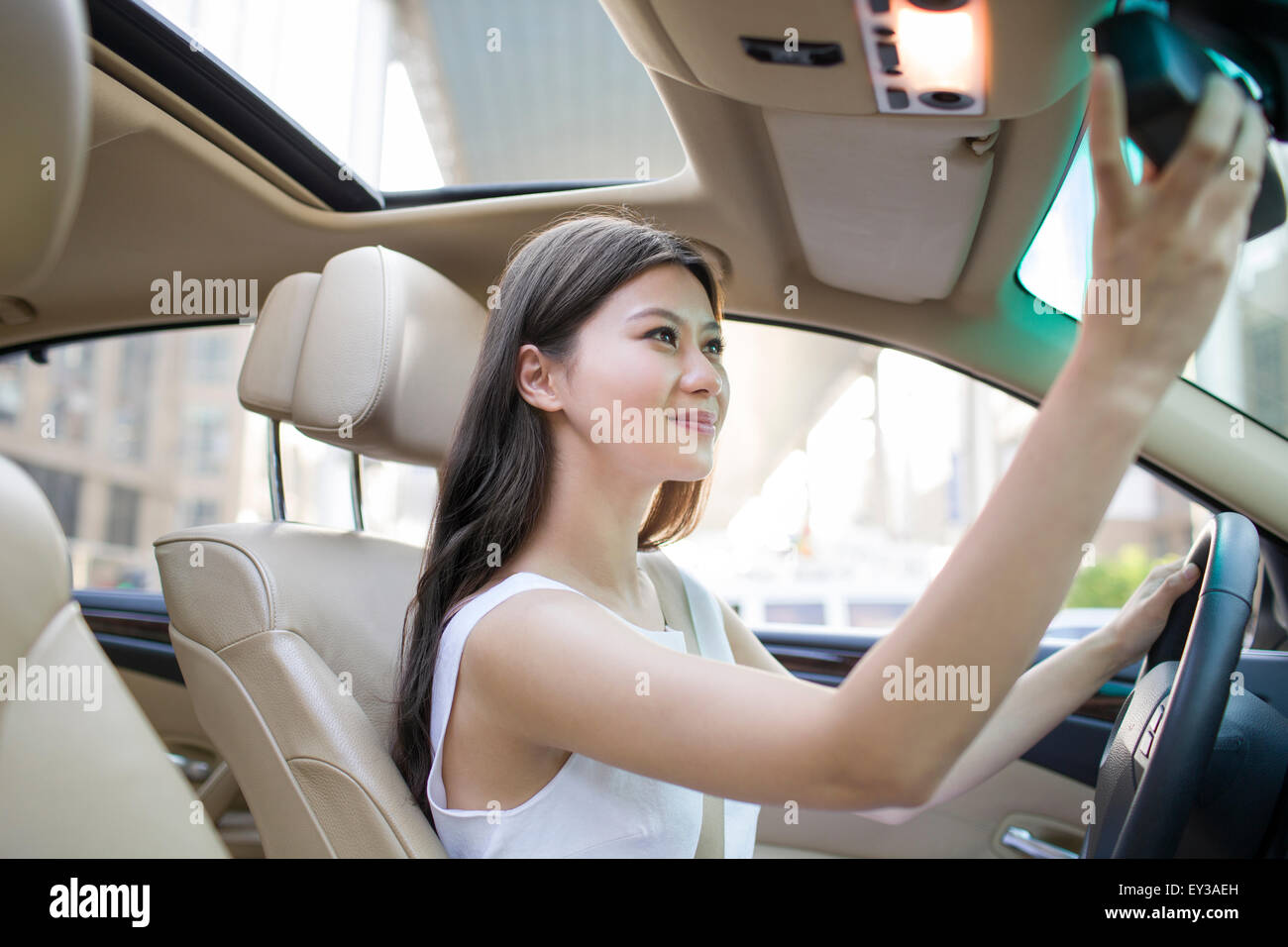 Young woman driving car Stock Photo - Alamy