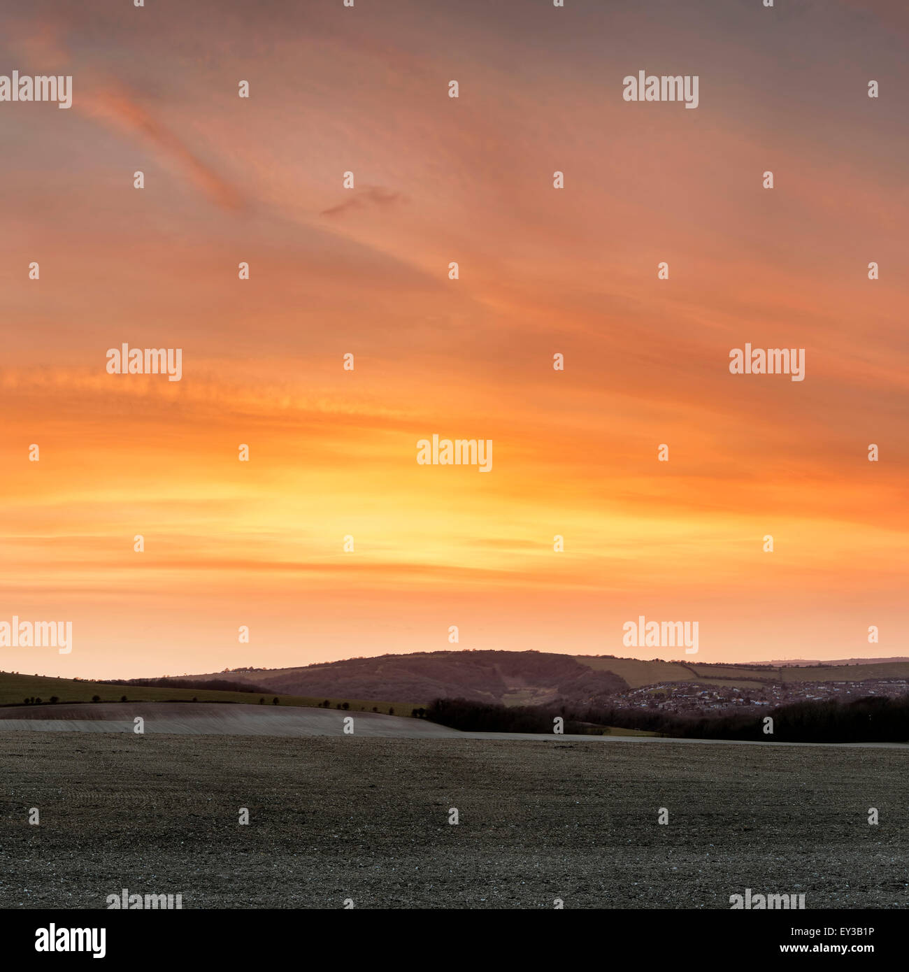 Stunning sunset over farm landscape with vibrant colors Stock Photo - Alamy
