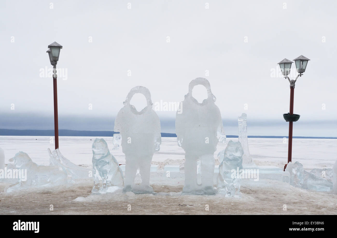 ice statues of men with dogs on the lake Stock Photo - Alamy