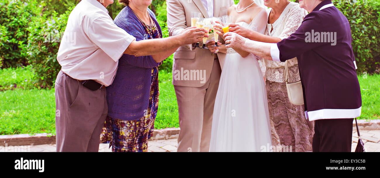 groom and bride with friends Stock Photo - Alamy