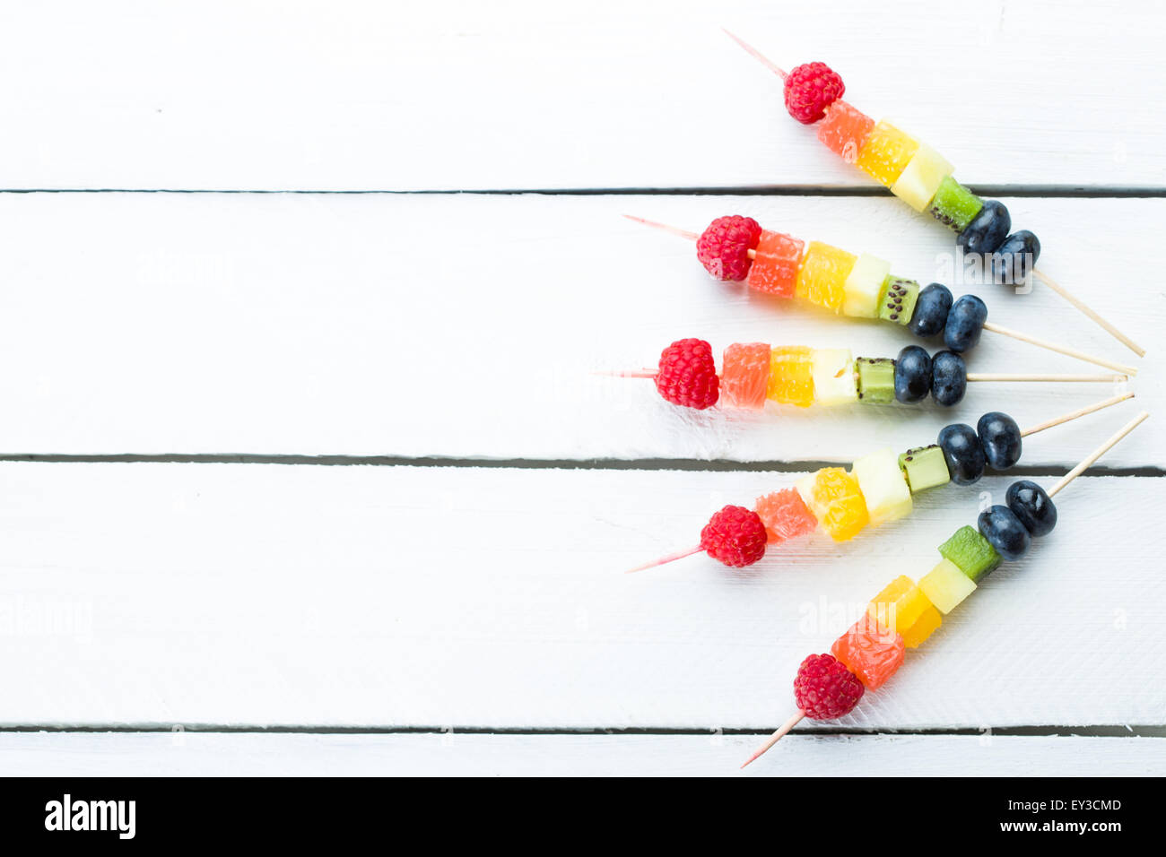 Fresh summer fruits on sticks Stock Photo - Alamy