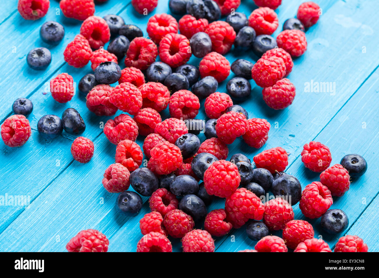 Summer berries on wooden background Stock Photo - Alamy