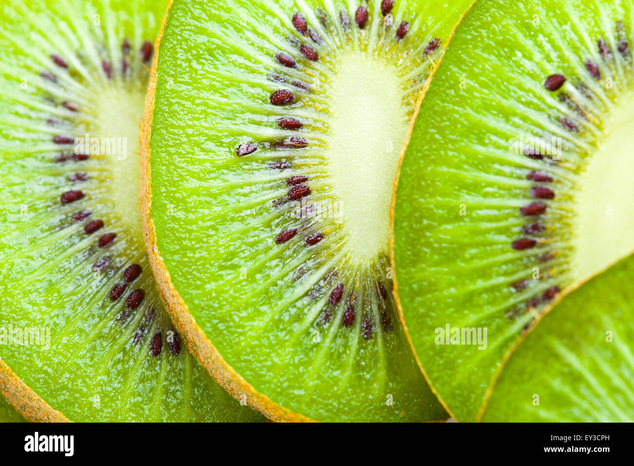 Kiwi cut by segments Stock Photo - Alamy