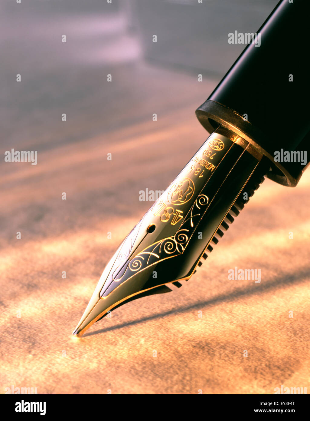 A very detailed close up of a fountain pen nib on paper, the pen is a ...