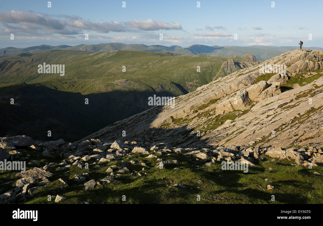The Great Slab Bowfell. summer evening on bowfell, hiker on the great ...