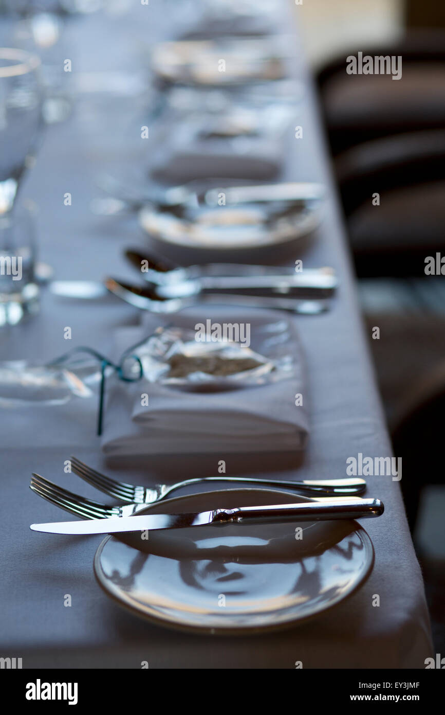 Close up of crockery and cutlery on a table Stock Photo - Alamy
