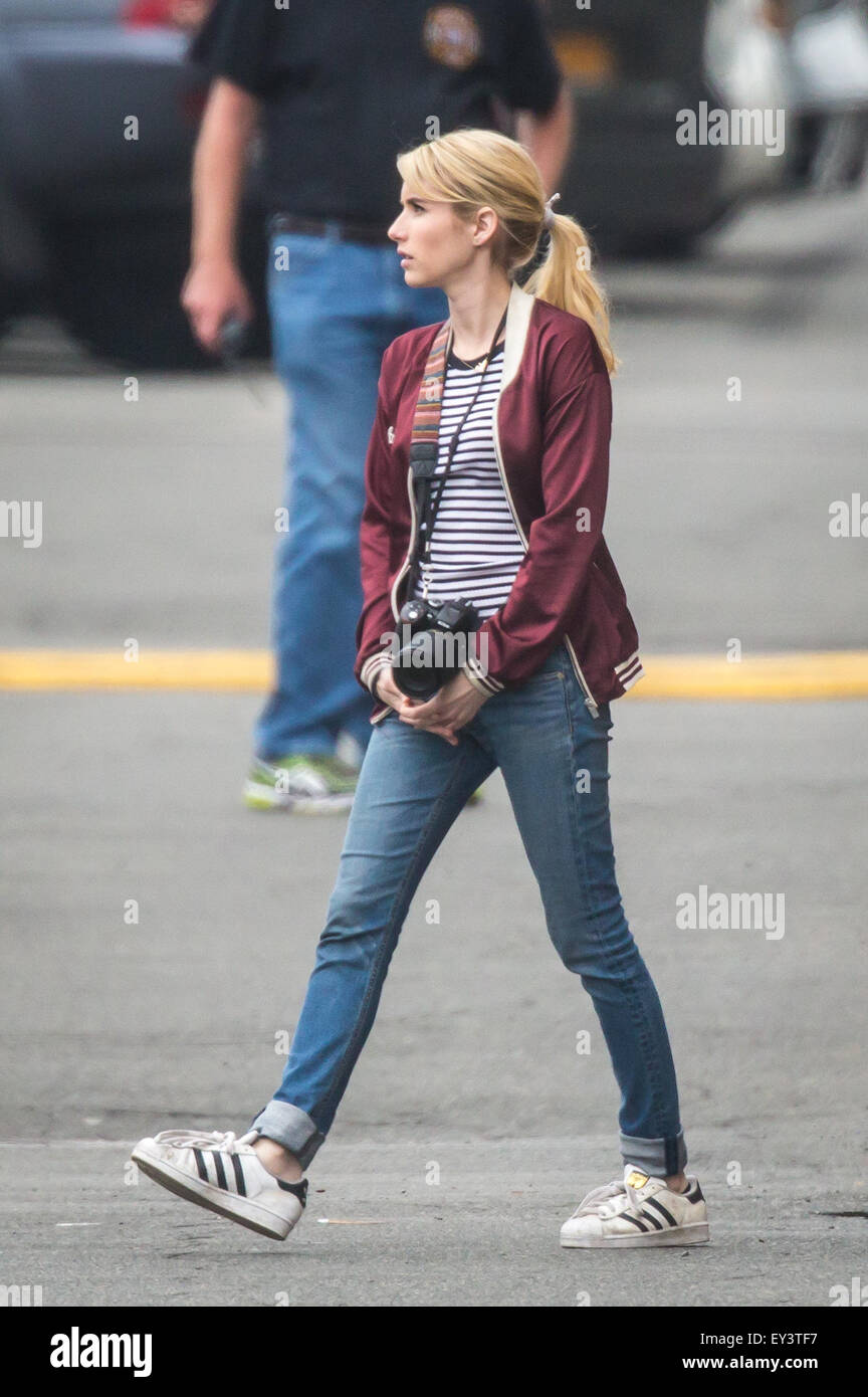 Emma Roberts acting as a high school sports photographer on the set of ...
