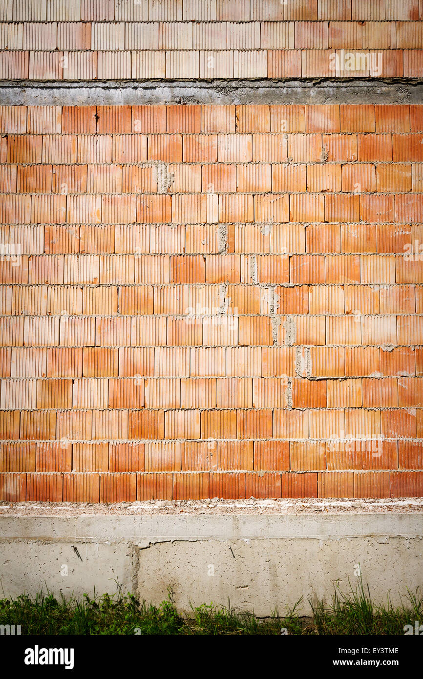 Newly built red block wall Stock Photo - Alamy