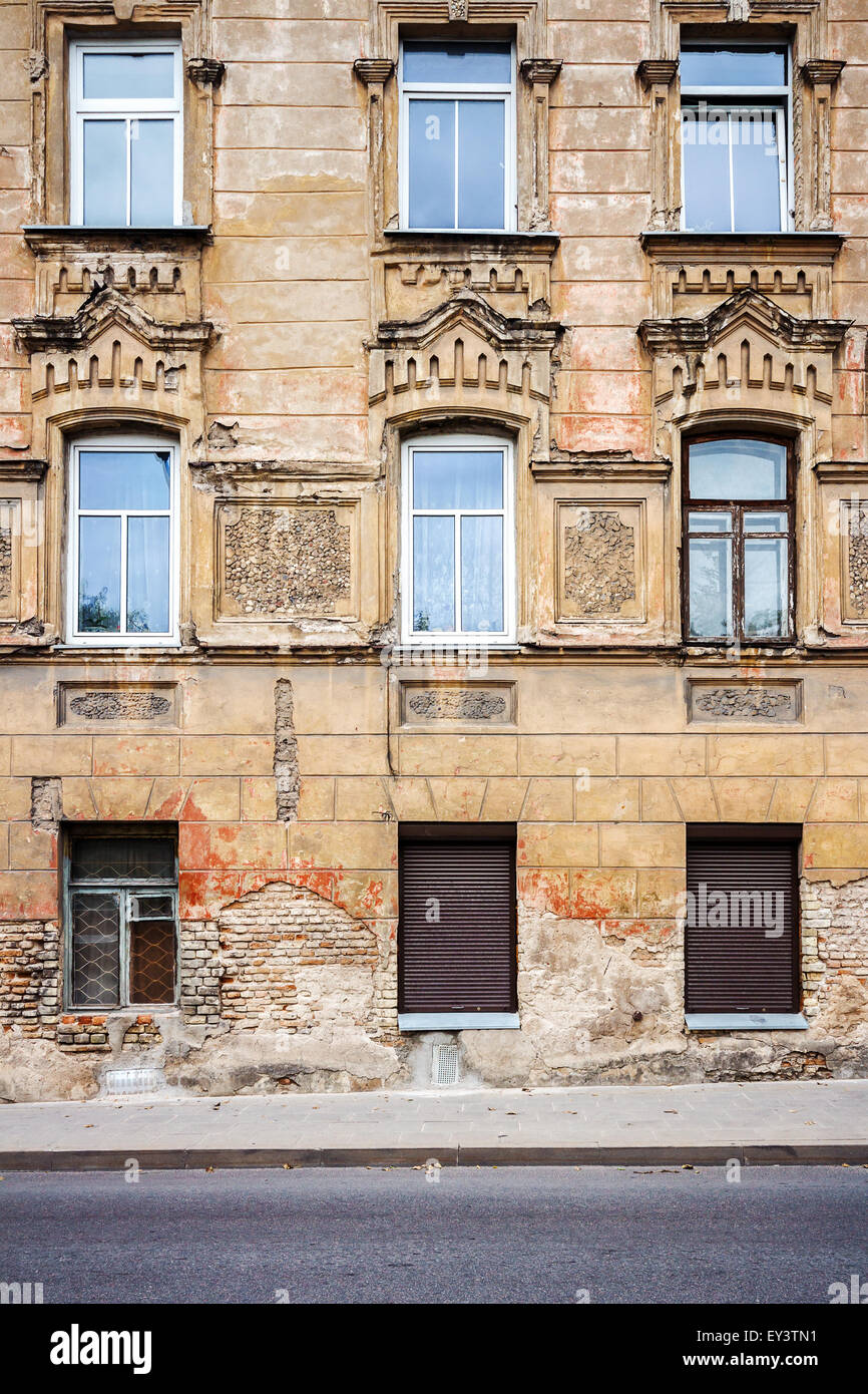 Old weathered street wall with some windows and door Stock Photo - Alamy