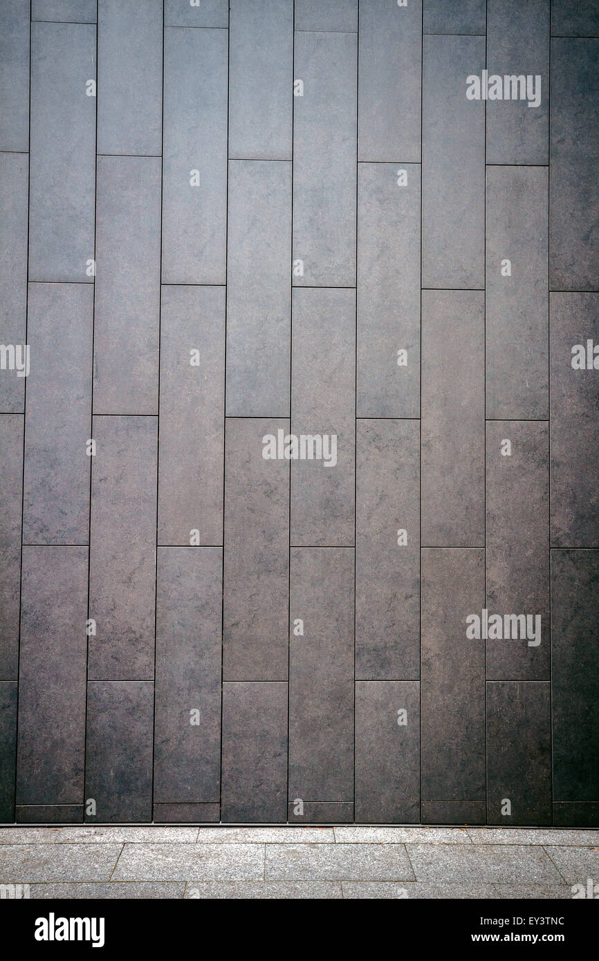 Modern dark stone tile wall and sidewalk Stock Photo - Alamy