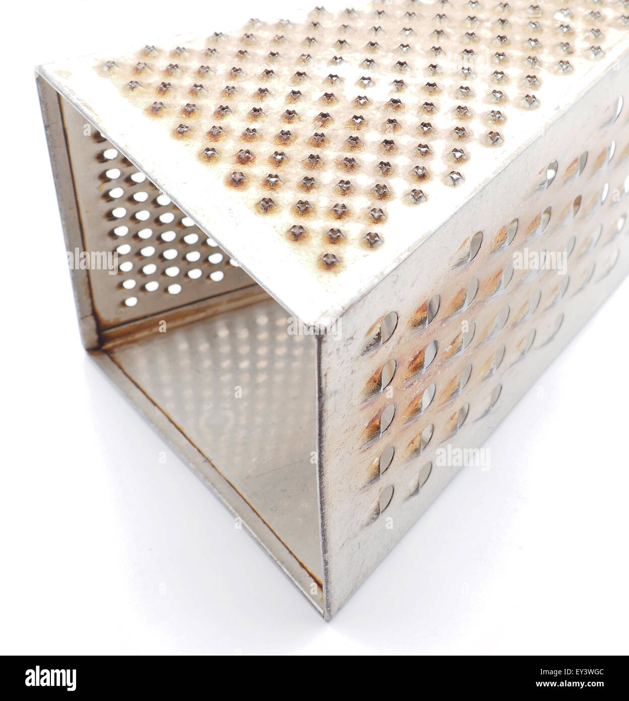 Metal grater on a white background Stock Photo - Alamy