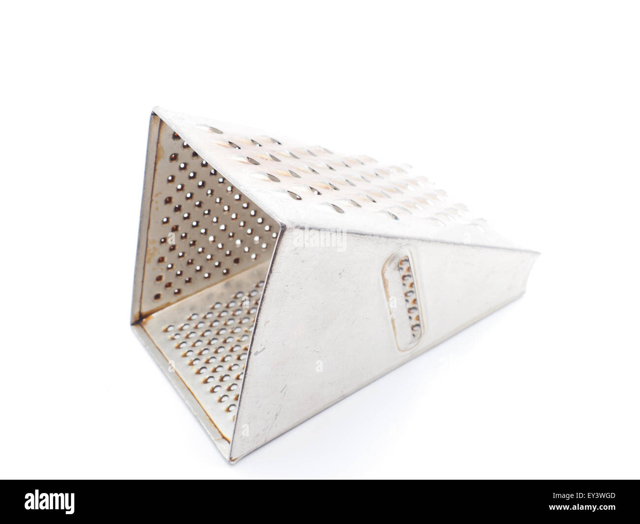 Metal grater on a white background Stock Photo - Alamy