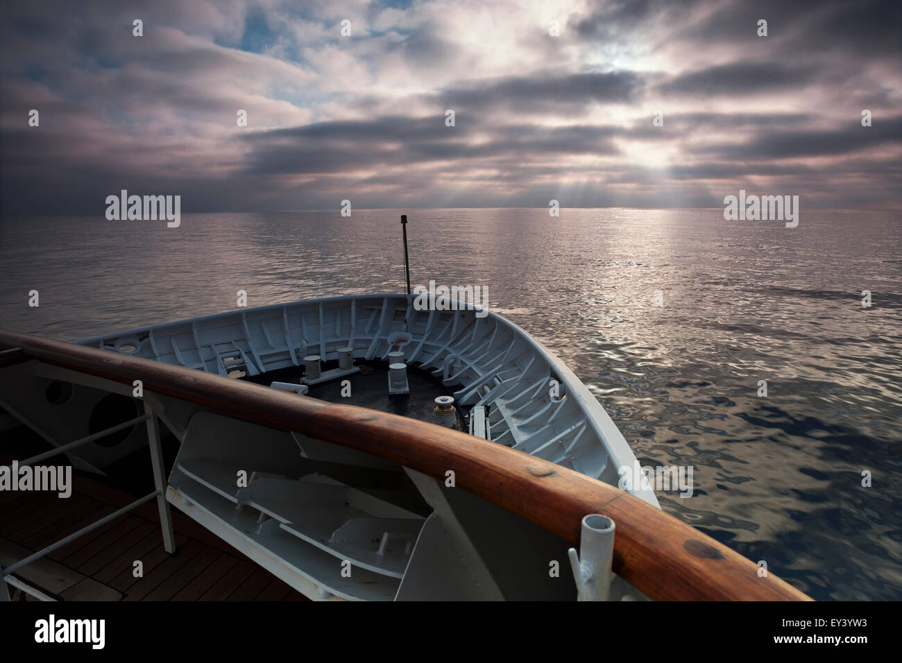 View across the ocean from the bow of a cruise ship at dawn Stock Photo ...