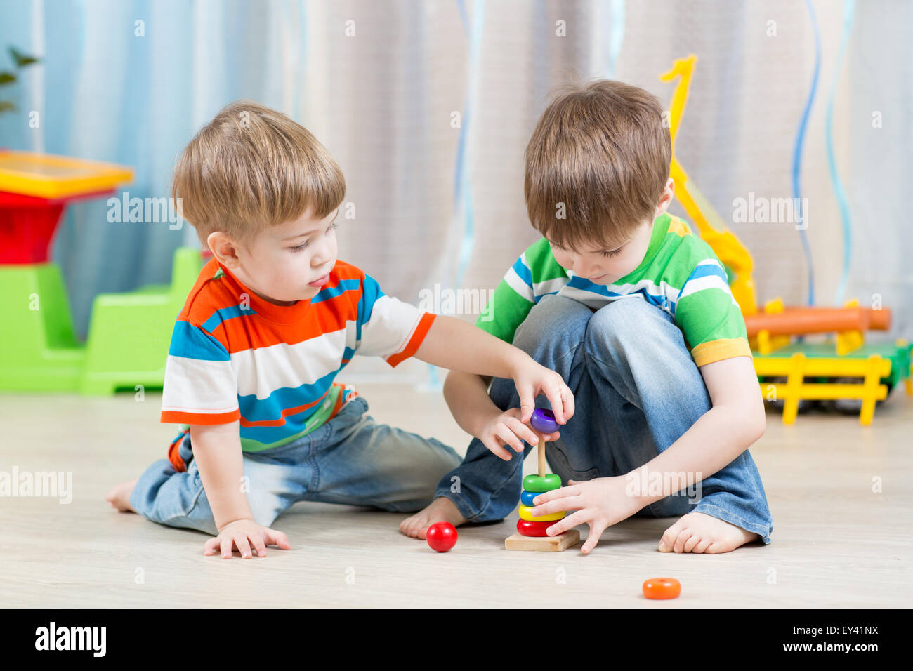 little children playing with toys Stock Photo - Alamy