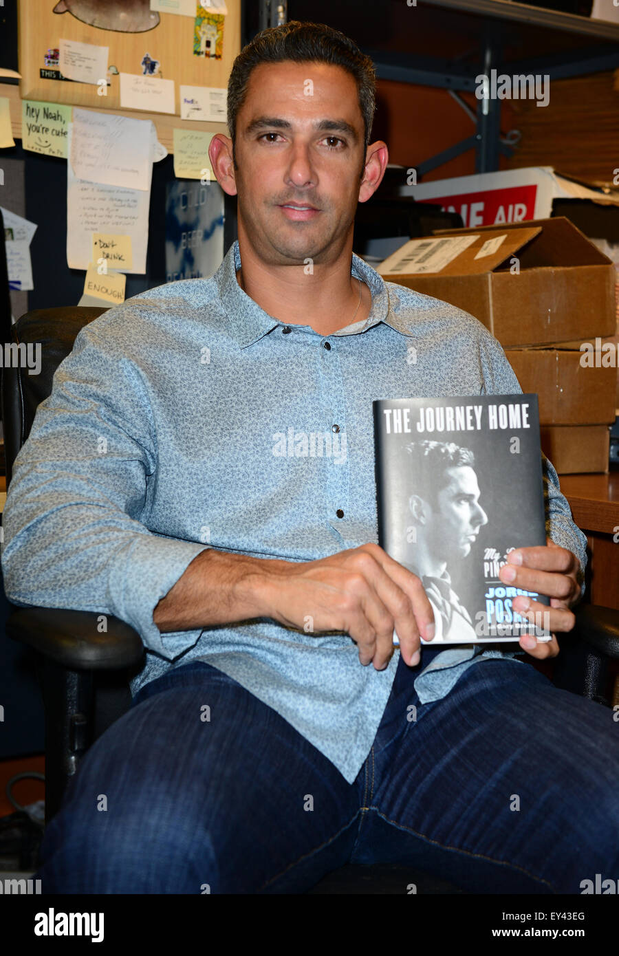 Jorge Posada greets fans and signs copies of his book 'The Journey Home ...