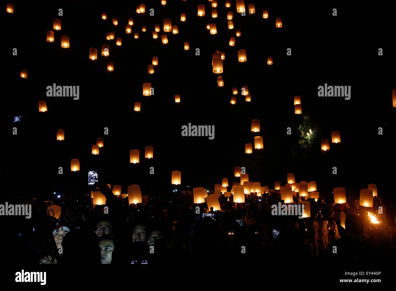 Buddhist followers release a lantern into the air on Borobudur temple ...