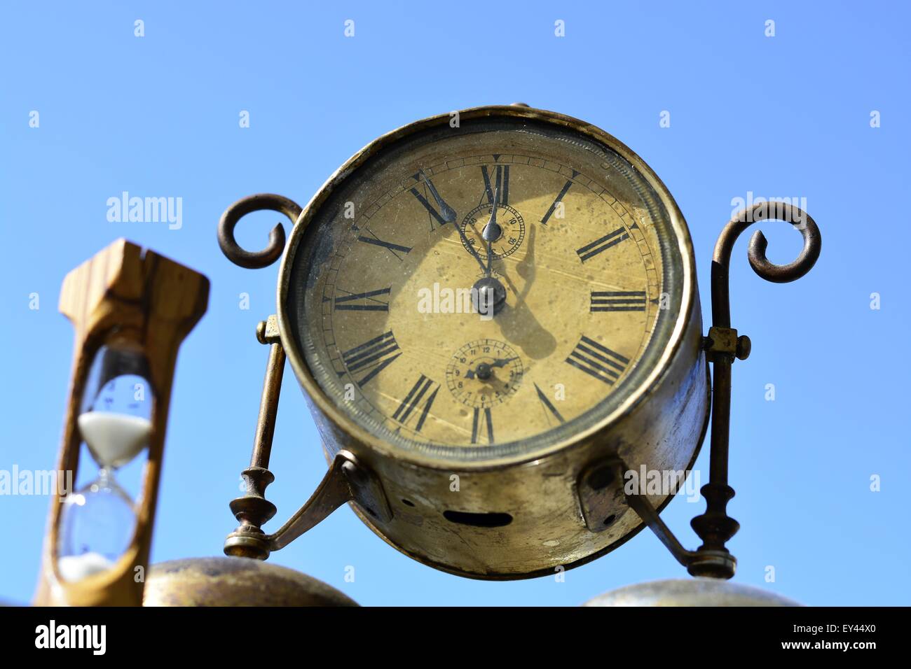 Old clock and hourglass Stock Photo - Alamy