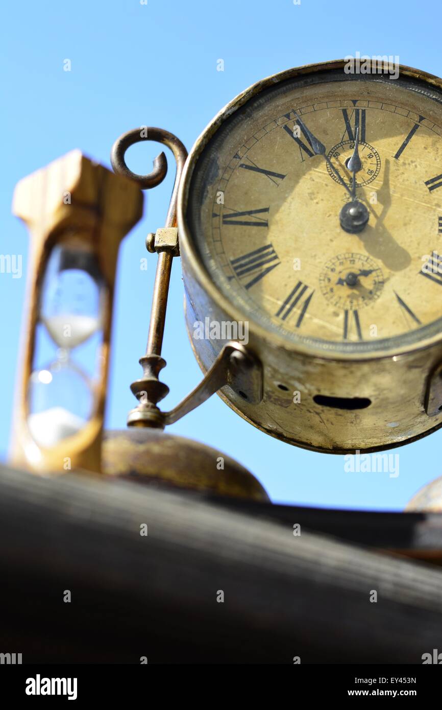 Old clock and hourglass Stock Photo - Alamy