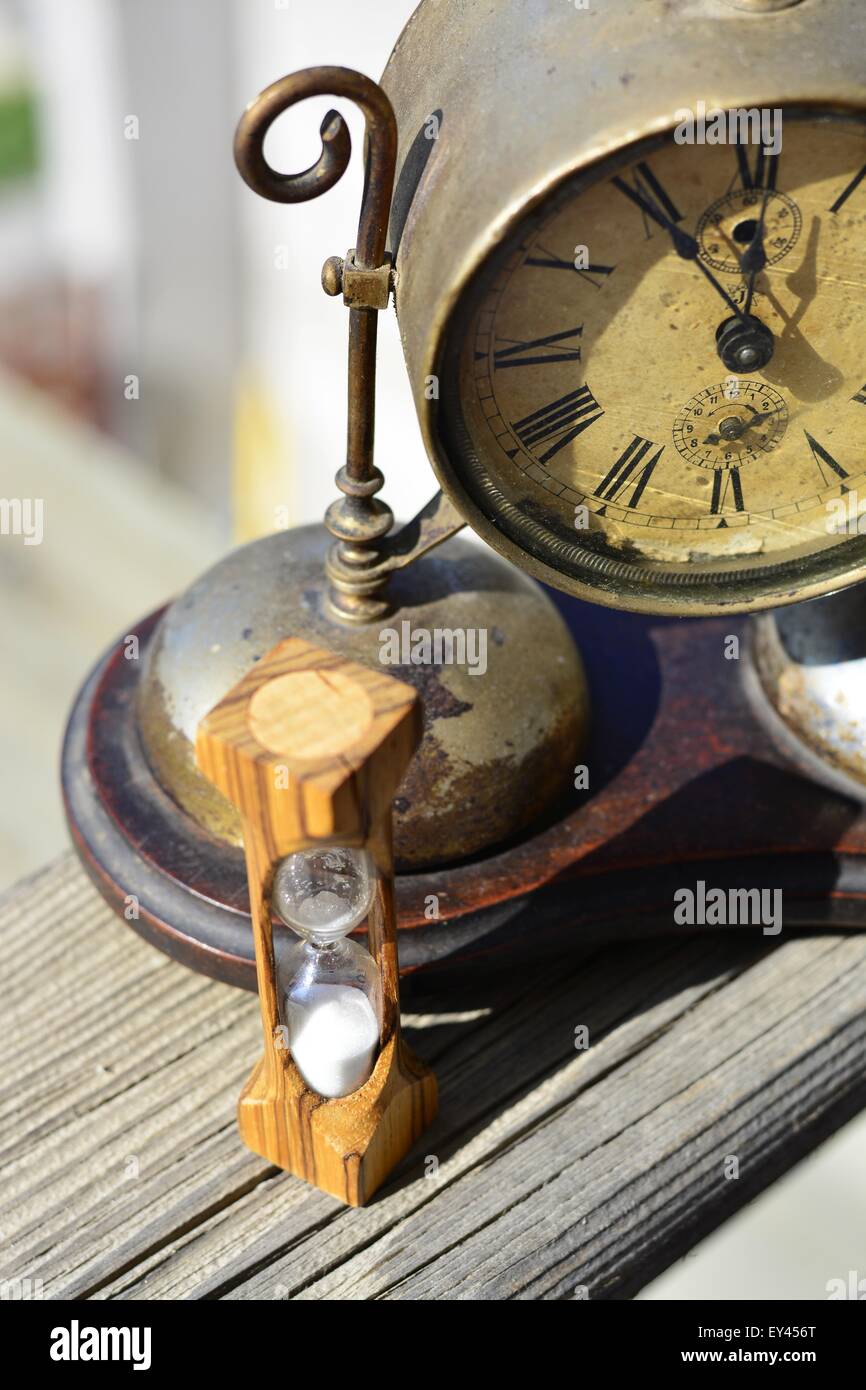 Old clock and hourglass Stock Photo - Alamy