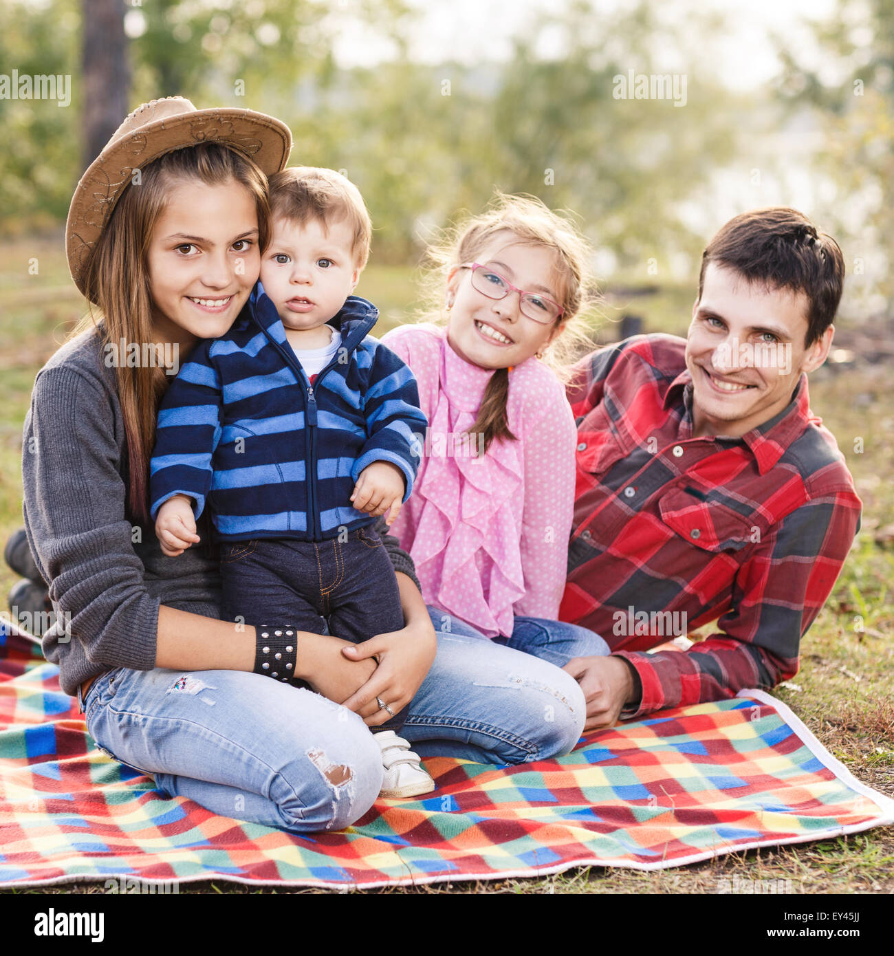 Happy family outdoors Stock Photo - Alamy
