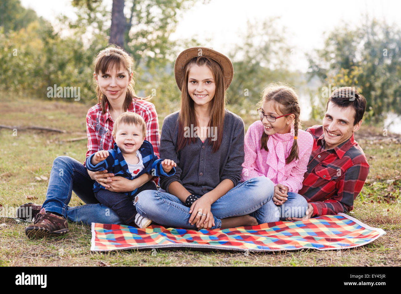 Happy family outdoors Stock Photo - Alamy