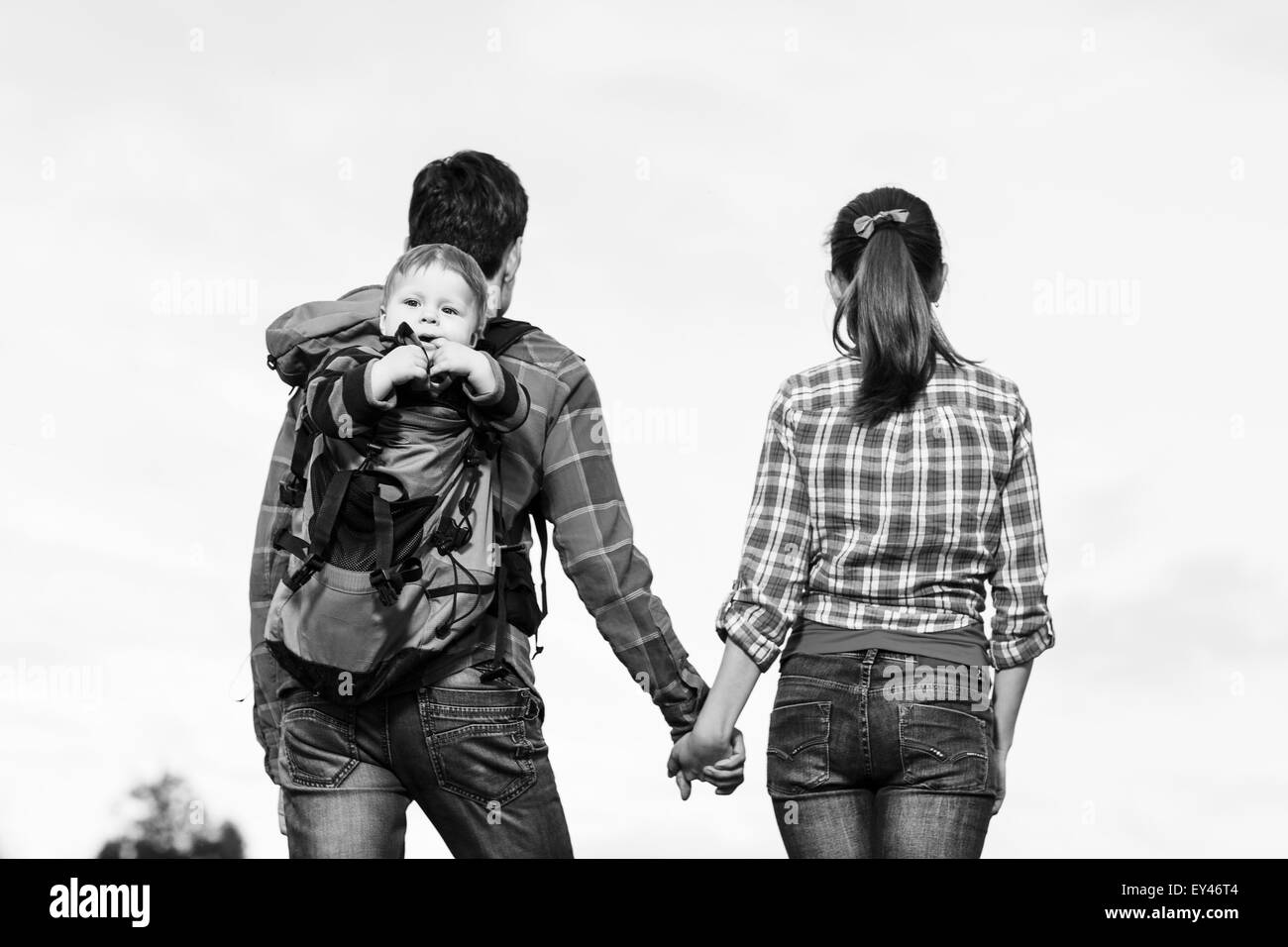 Baby boy in backpack Stock Photo - Alamy
