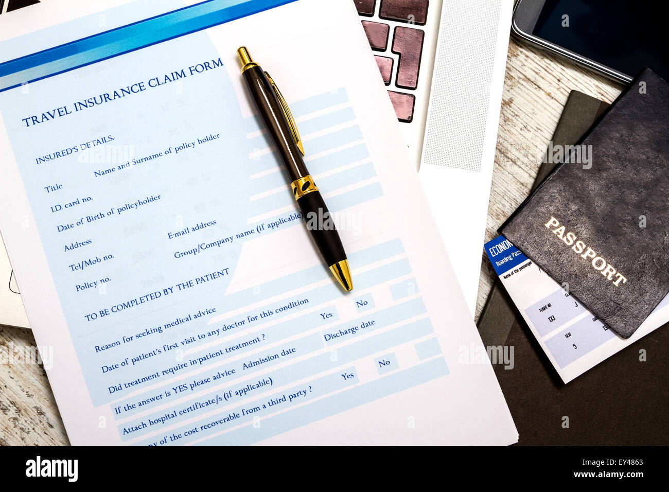 Travel insurance application form with a boarding pass and a passport ...