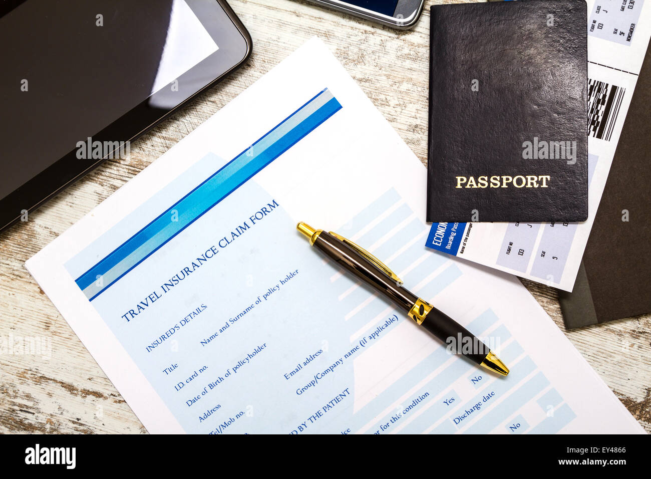 Travel insurance application form with a boarding pass and a passport ...