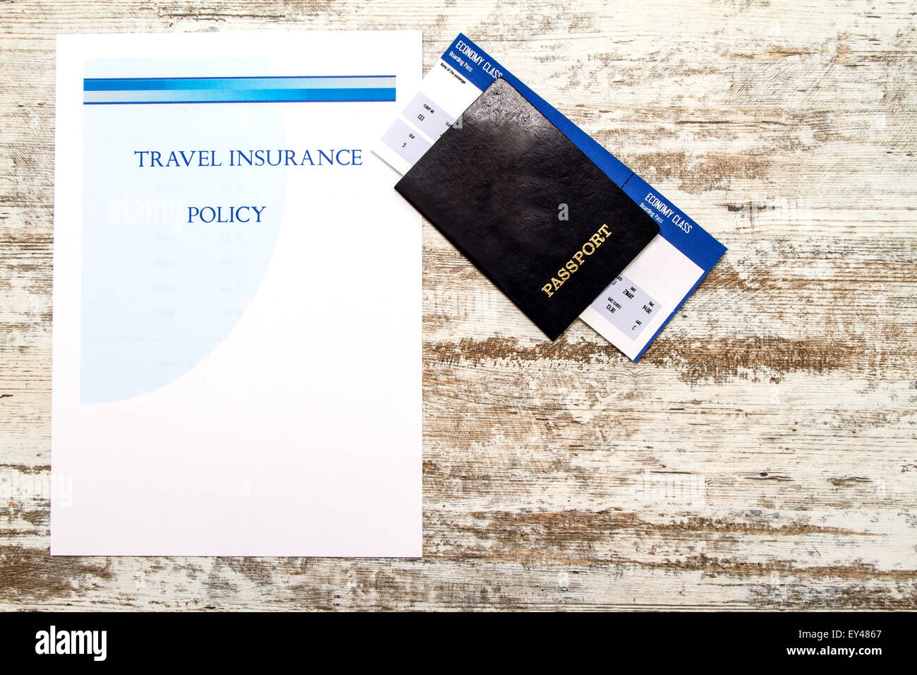 Travel insurance policy booklet with a boarding pass and a passport ...