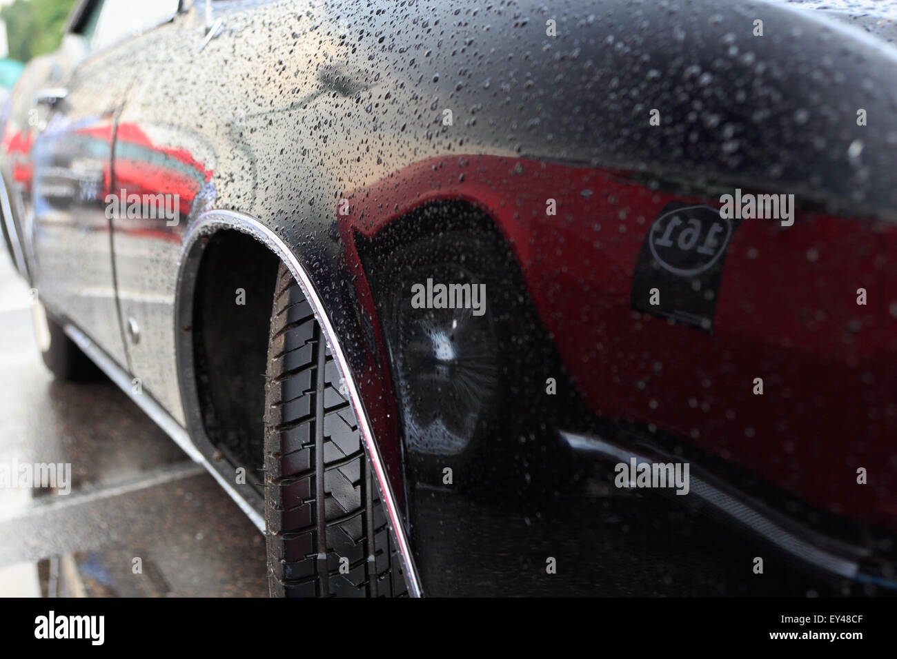 Black sport car after the rain with droplets Stock Photo - Alamy