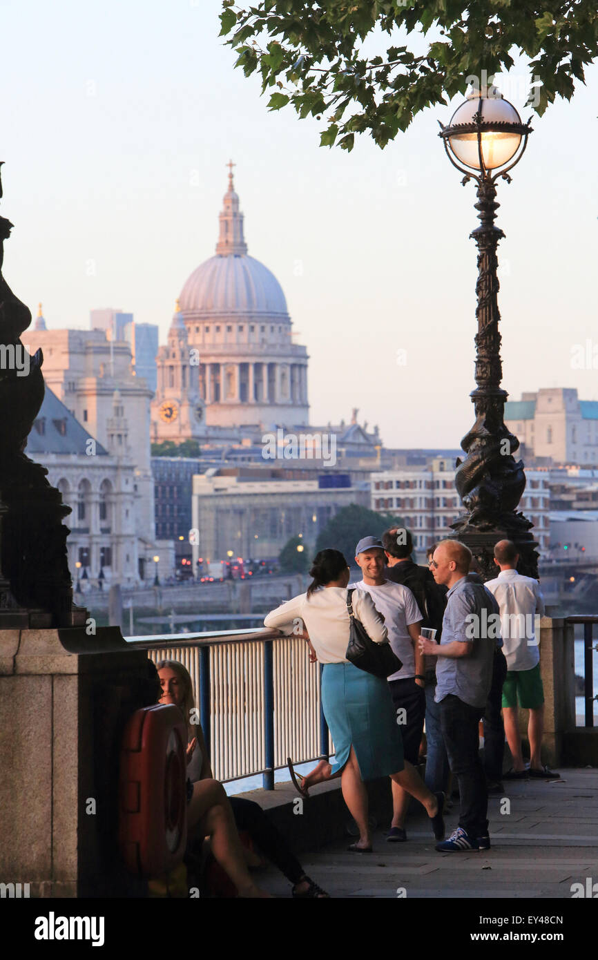 People strolling along the South Bank on a warm summer's evening, St ...