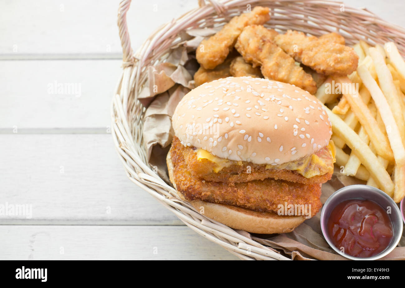 double fish burger, french fried and chicken fried Stock Photo - Alamy