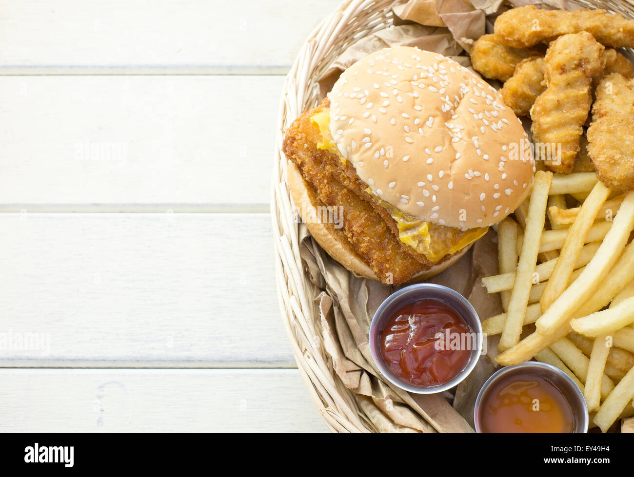 double fish burger, french fried and chicken fried Stock Photo - Alamy