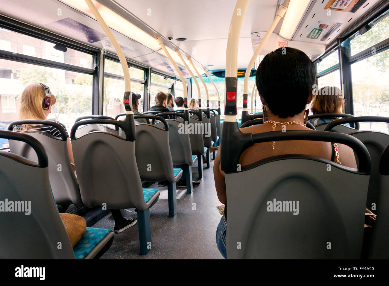 Bus passengers UK; Passengers sitting aboard on the upper deck of a ...