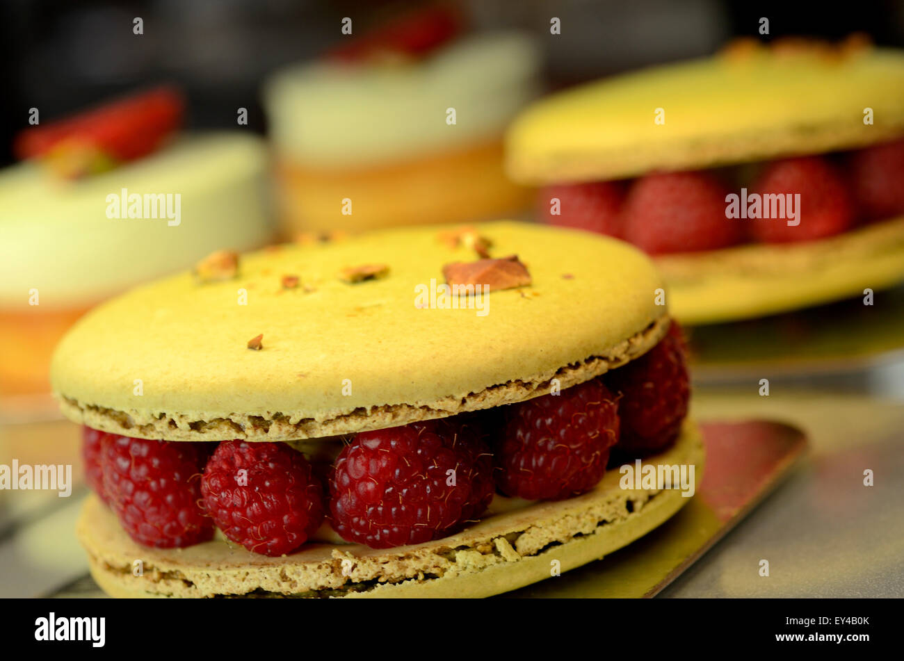 Pistachio Macarons with Raspberries Stock Photo - Alamy
