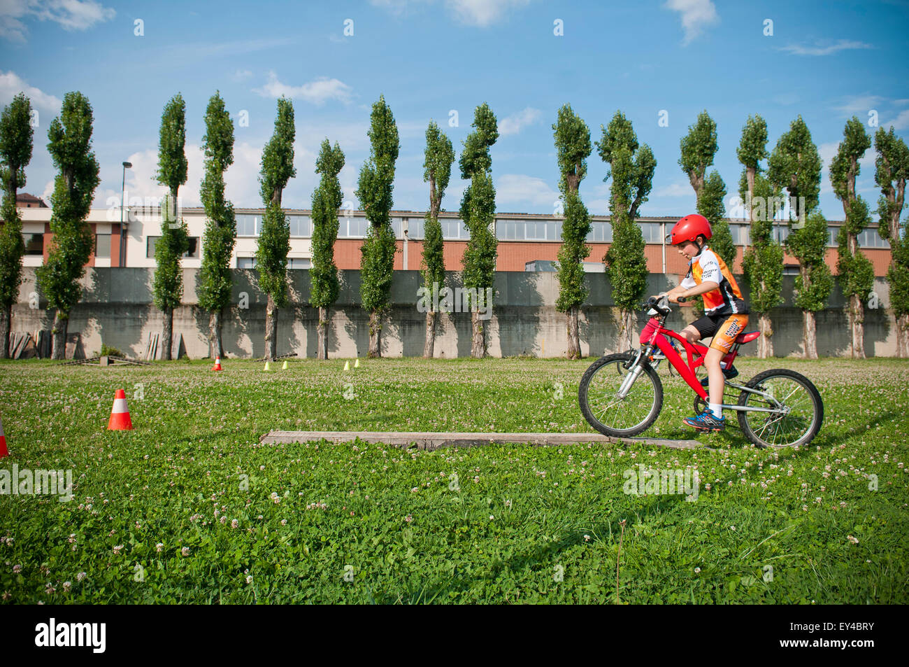 Boy Riding Mountain Bike Through Obstacle Course Stock Photo - Alamy