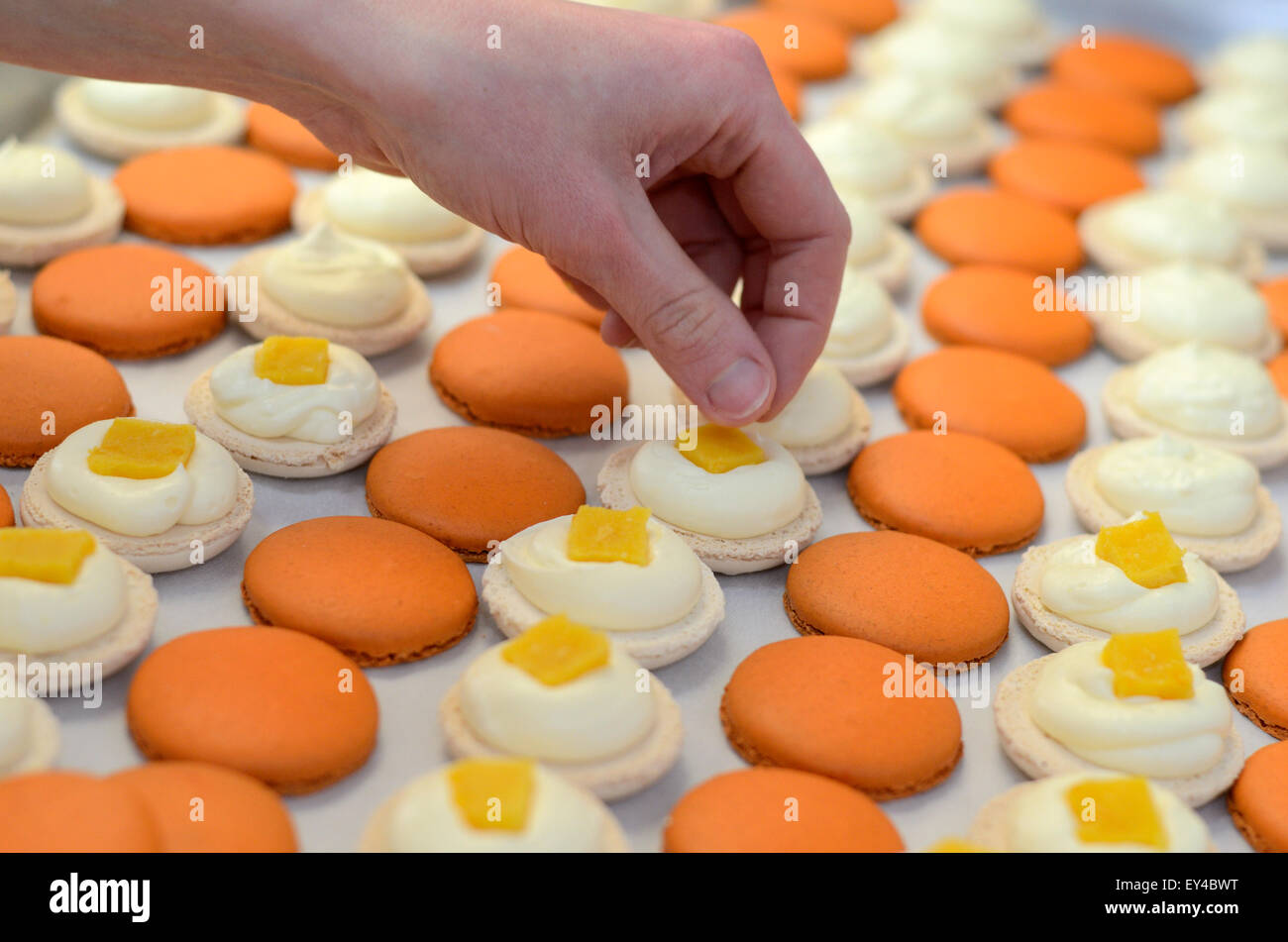 Baker Decorating Macarons, Close-Up Stock Photo - Alamy