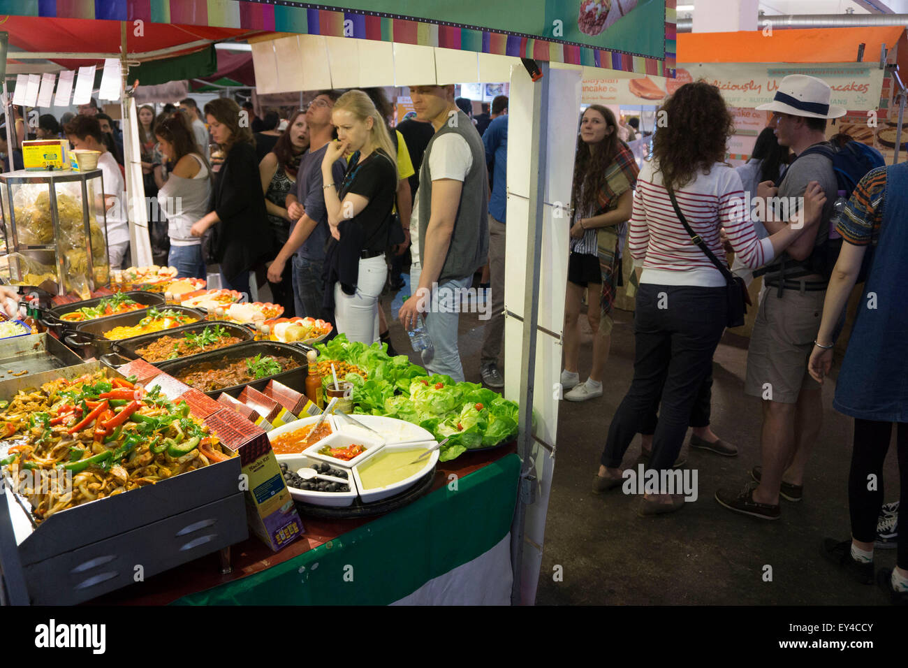 Food stalls inside at Brick Lane Market, London, UK. Foods from all ...
