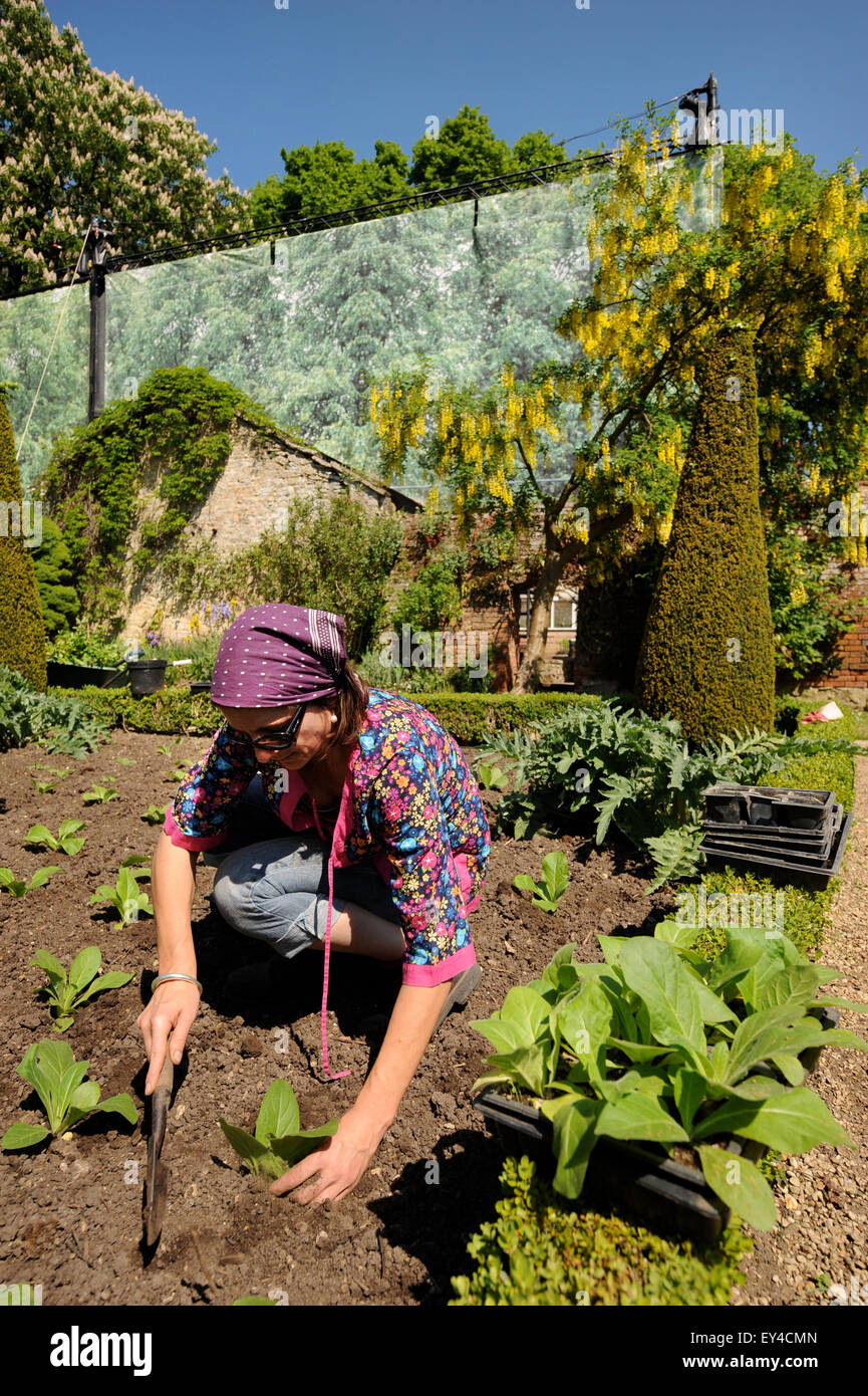 Head gardener Hannah Gardner in the parterre garden at Garsington Manor ...
