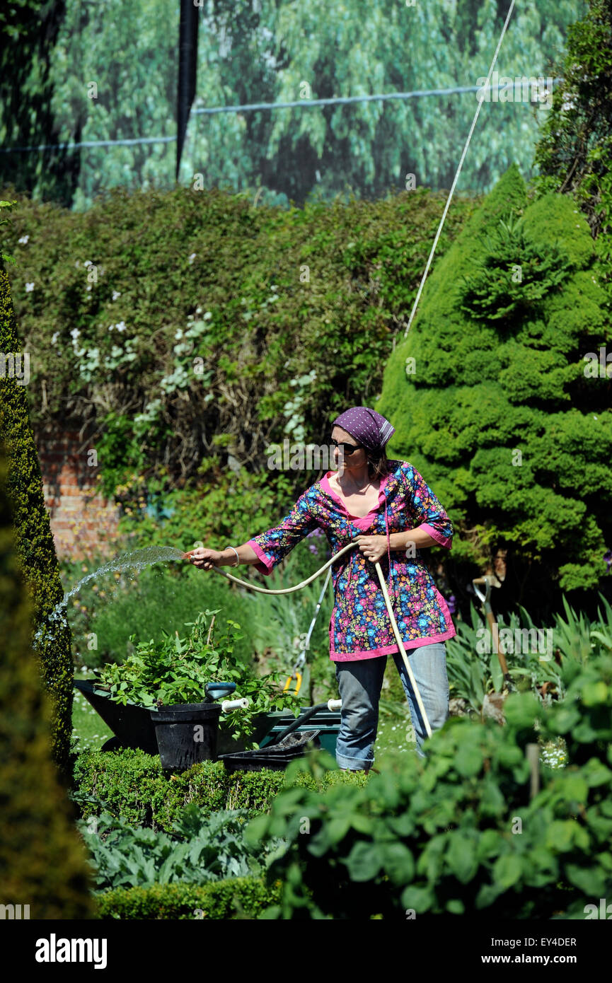 Head gardener Hannah Gardner in the parterre garden at Garsington Manor ...