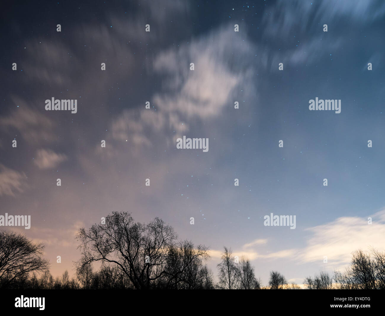 Cloudy sky with moon and stars at night Stock Photo - Alamy