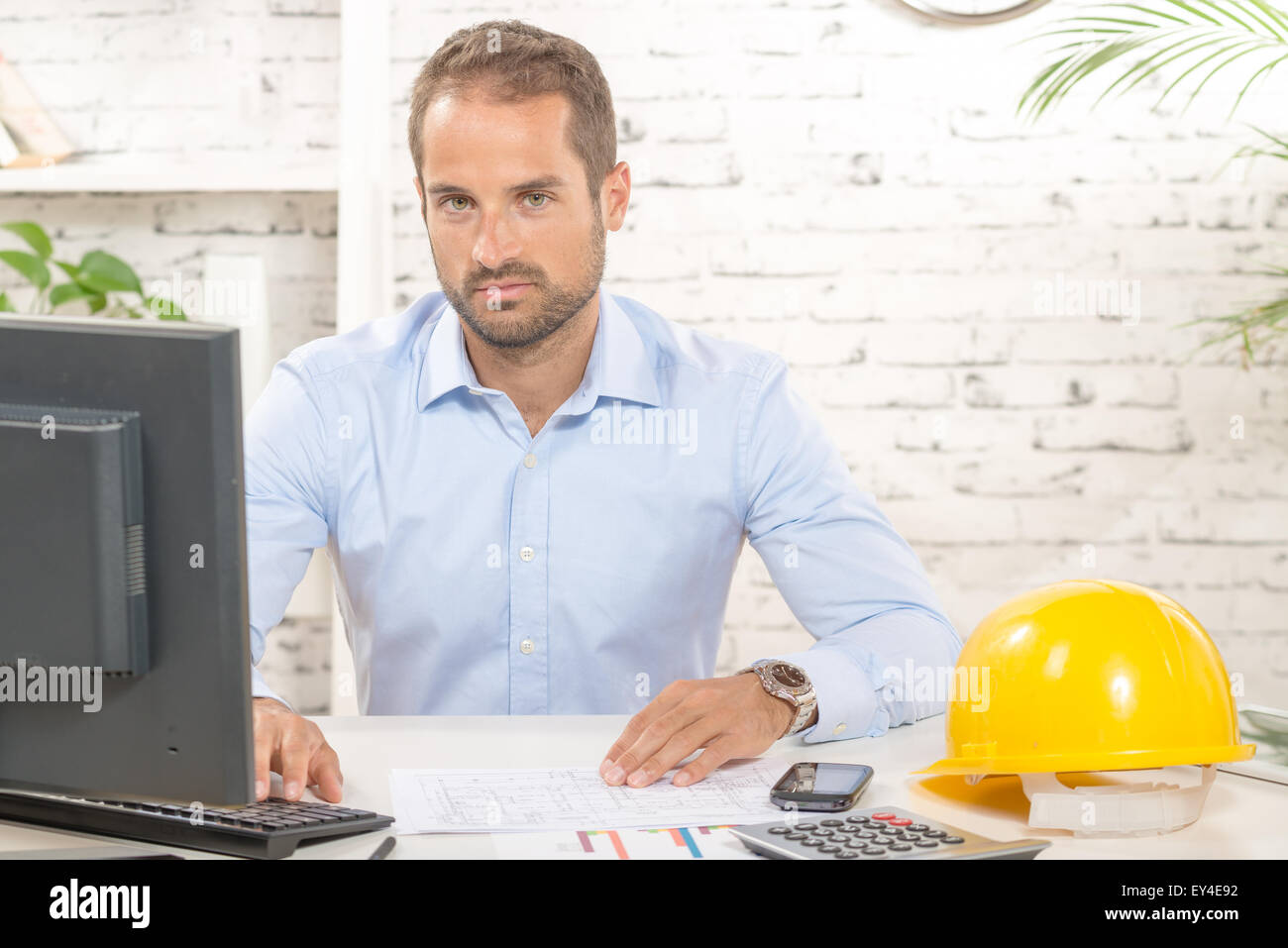 young engineer working on his computer on his office Stock Photo - Alamy