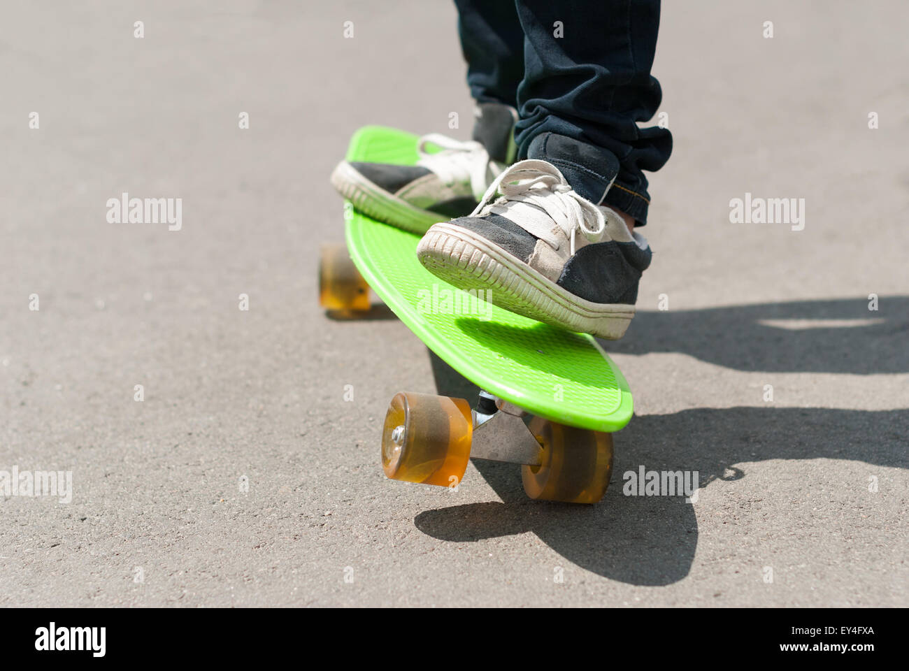 Skateboarder riding a skateboard Stock Photo - Alamy