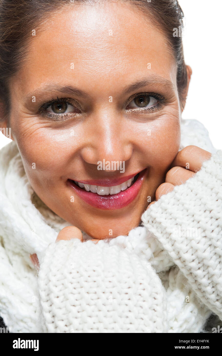 Attractive elegant woman in winter fashion snuggling down into her ...