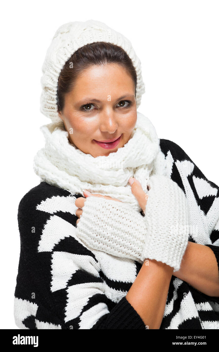 Attractive elegant woman in winter fashion snuggling down into her ...